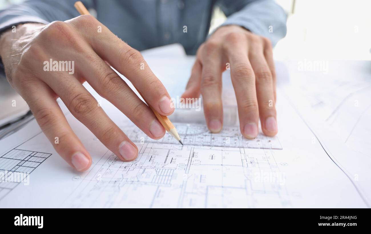 designer drawing graphic design of building project, improvement at ...