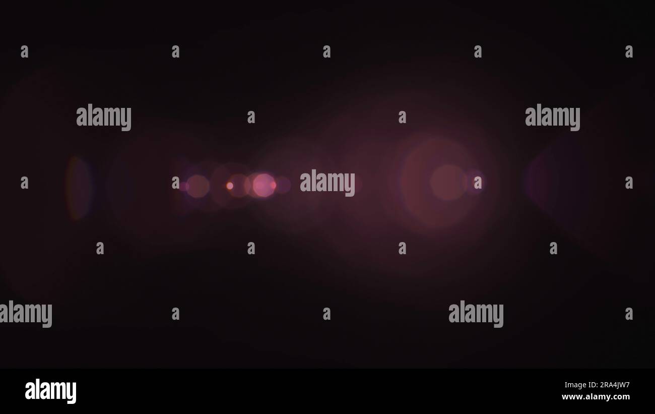 Set of pink light spots. Natural effect of lens flare on black ...