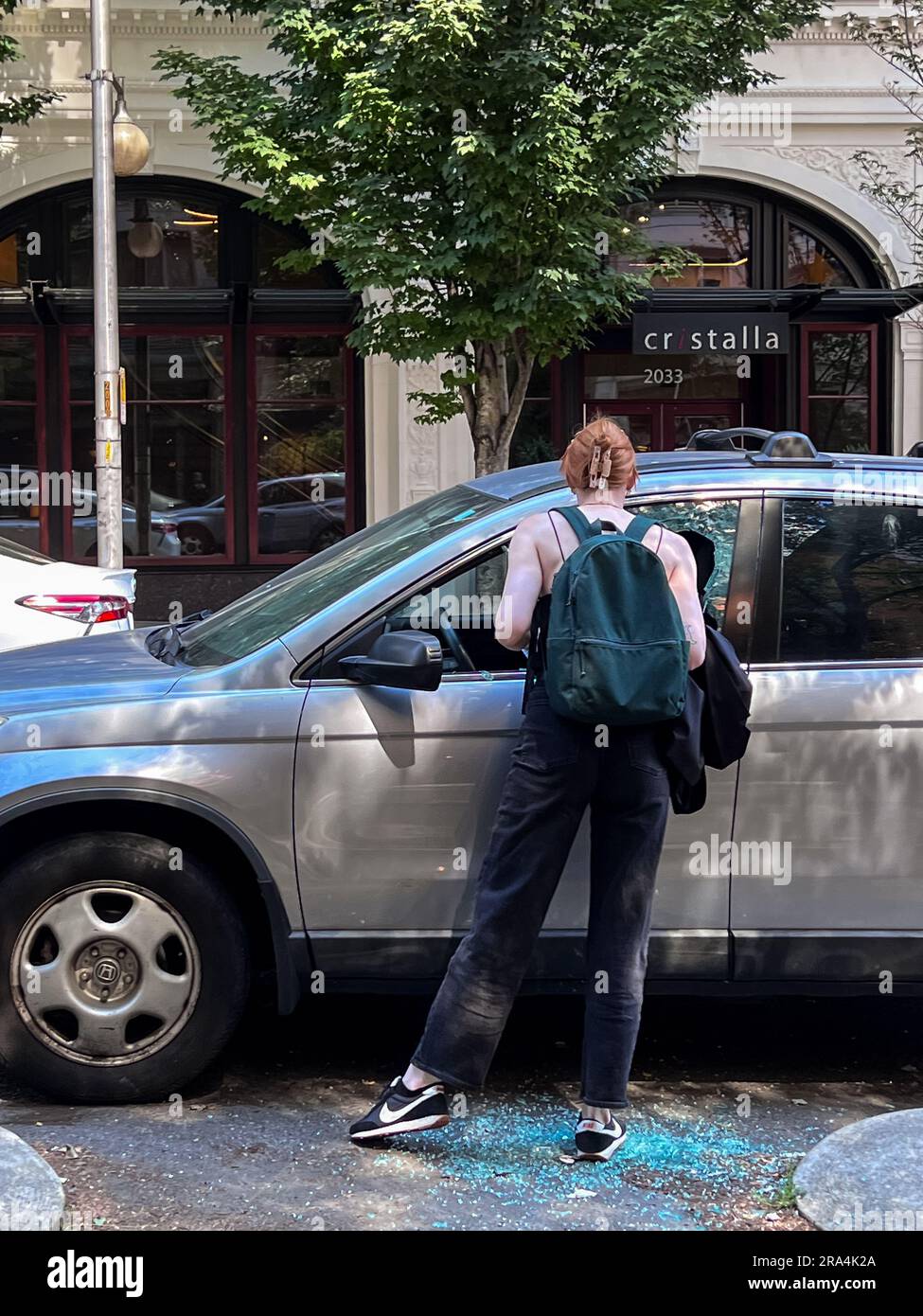 Woman smash car window hi-res stock photography and images - Alamy
