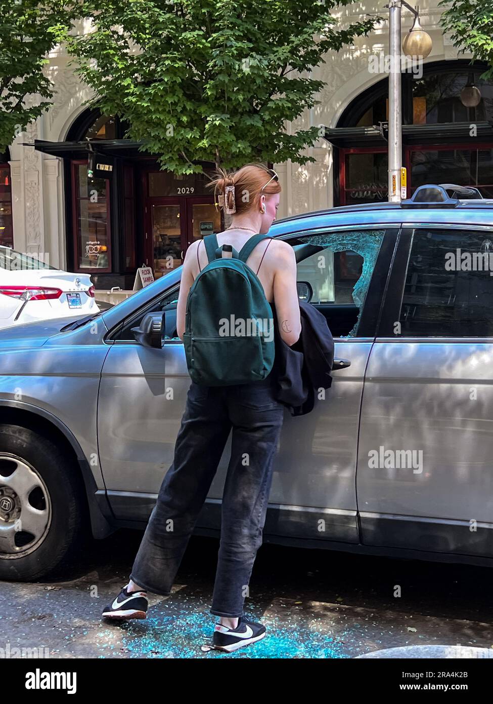 Woman smash car window hi-res stock photography and images - Alamy