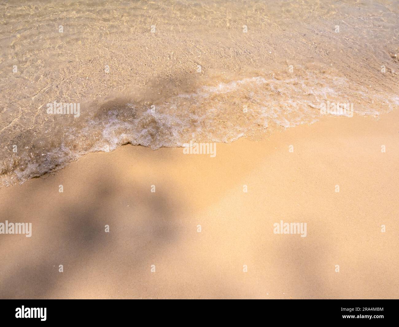 Bright beach background with empty space, movement of sea water and ...