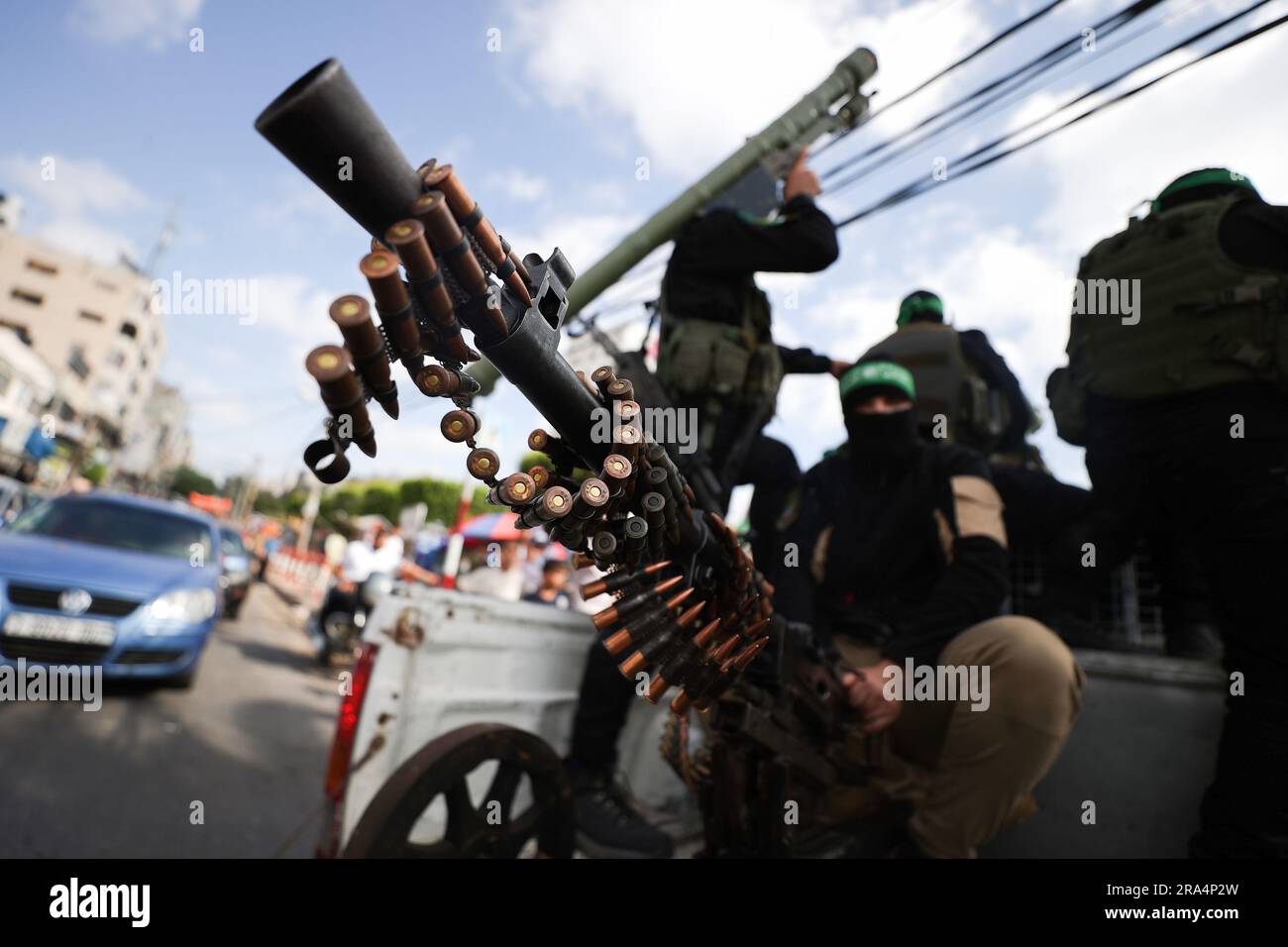 Hamas fighters attend a military exhibition under the name "Resistance ...