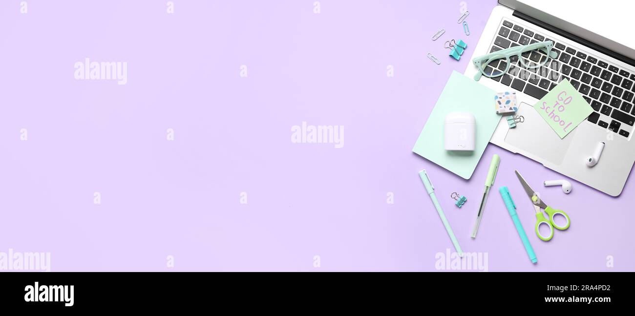 Sticky note with text GO TO SCHOOL, different stationery, laptop and ...