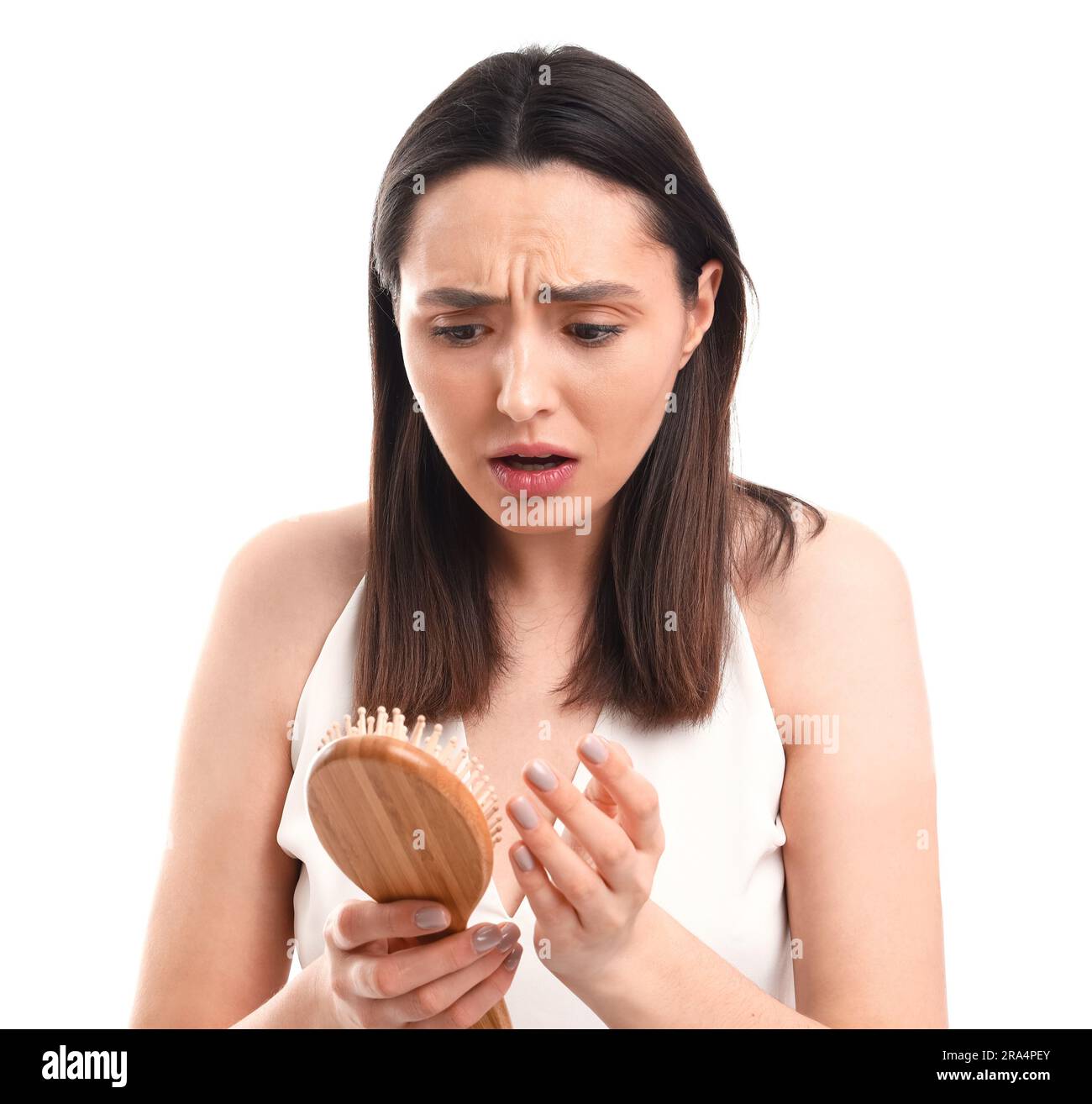 Worried young woman with hair loss problem on white background Stock ...