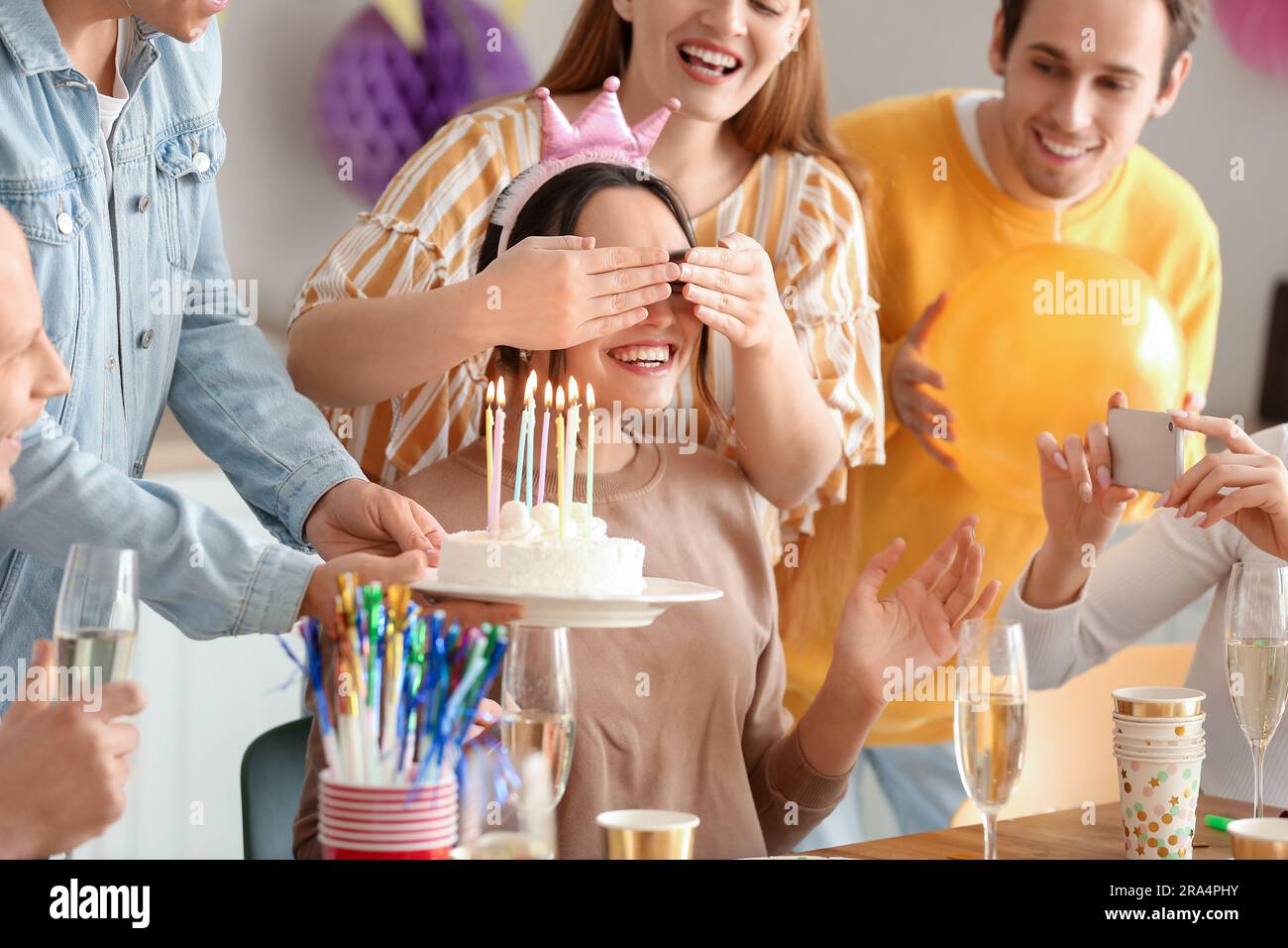 Young man bringing Birthday cake to his friend at party Stock Photo - Alamy