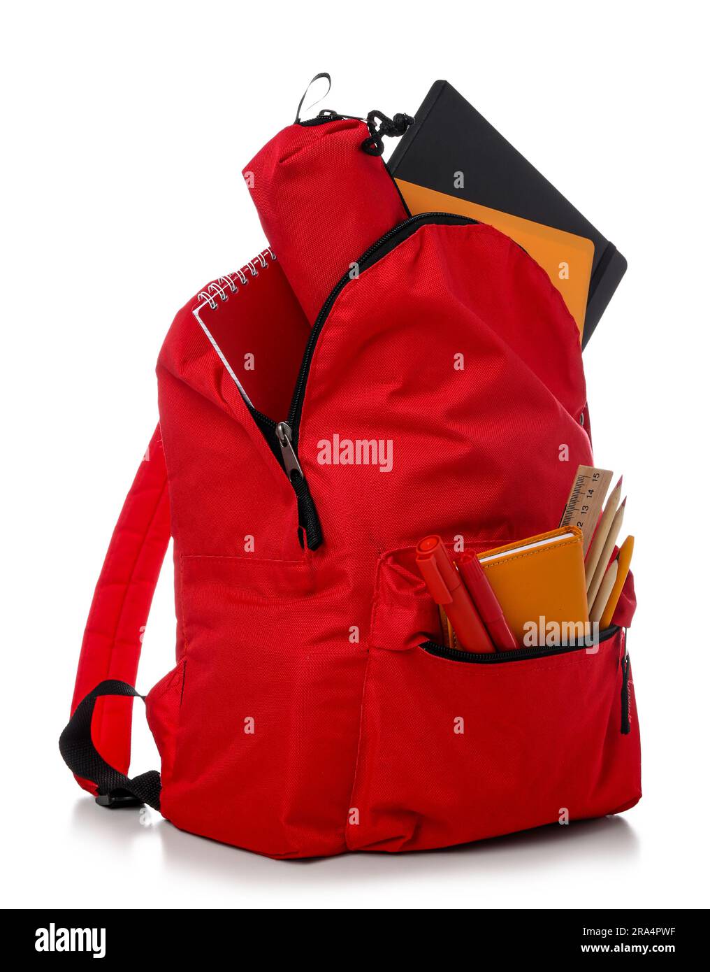 Red school backpack with notebooks, pencil case and markers on white ...