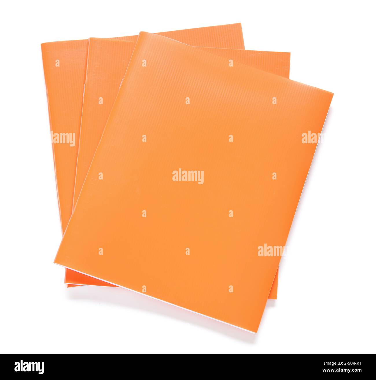 Orange notebooks isolated on white background Stock Photo - Alamy