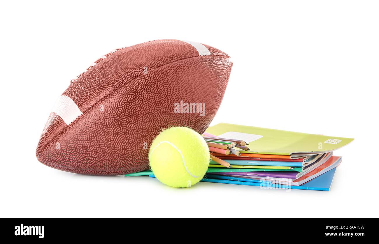 Notebooks with colorful pencils, rugby and tennis balls isolated on ...