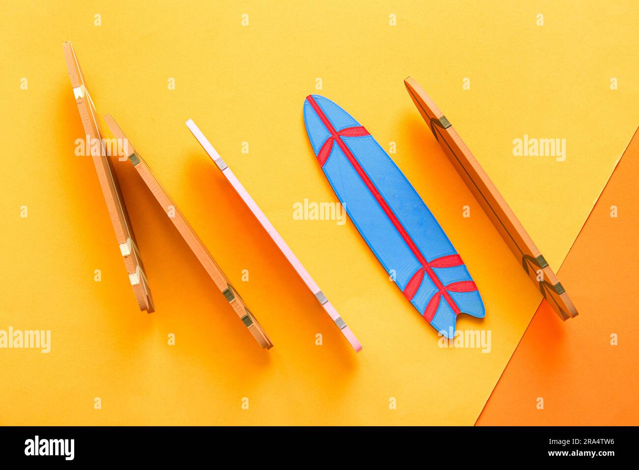 Mini surfboards on color background Stock Photo - Alamy