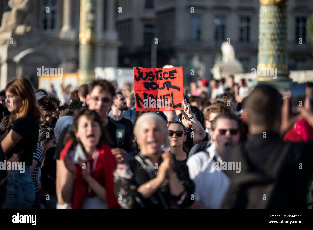 Paris, France. 30th June, 2023. A woman holds a placard reading ...