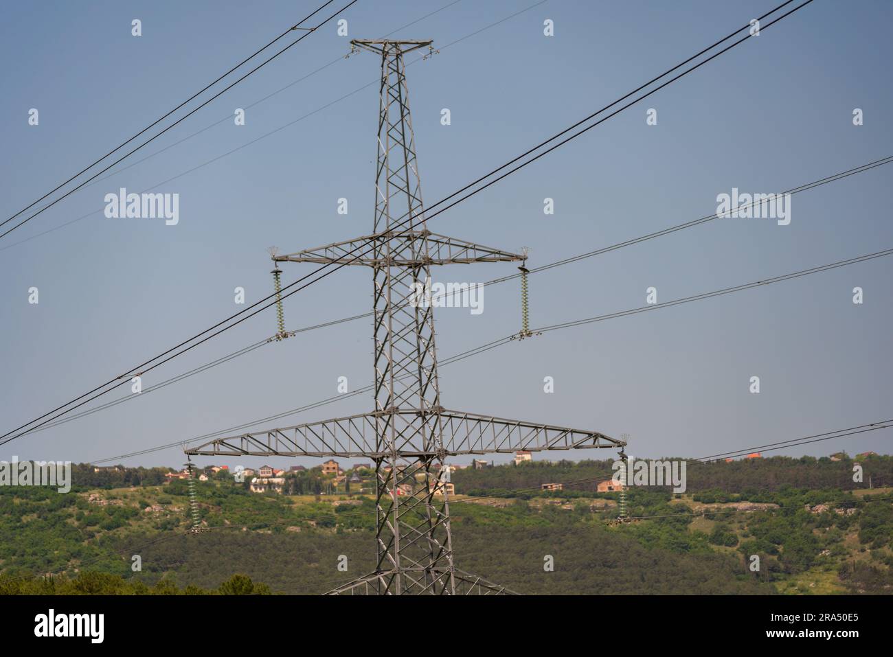 High voltage towers with sky background. Power line support with wires ...