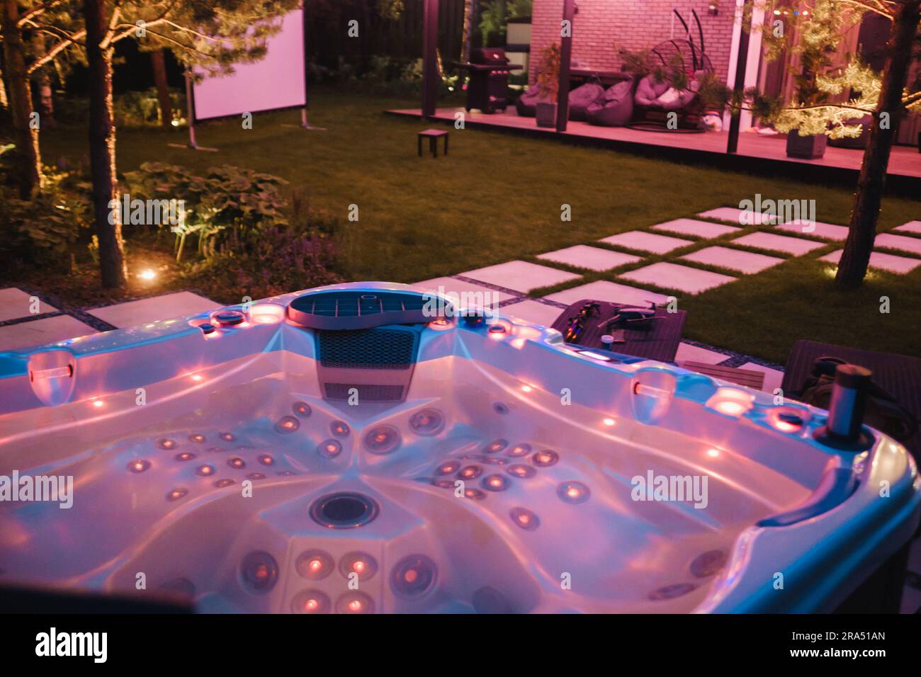 autonomous hot tub or jacuzzi with hot water and evening lighting Stock ...