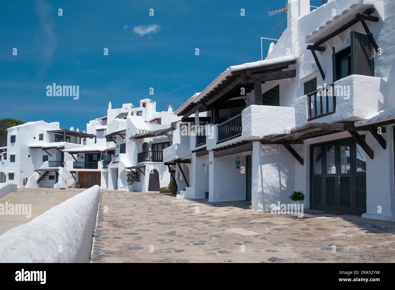 Streets and white walls of touristic fishing village of Binibeca Vell ...