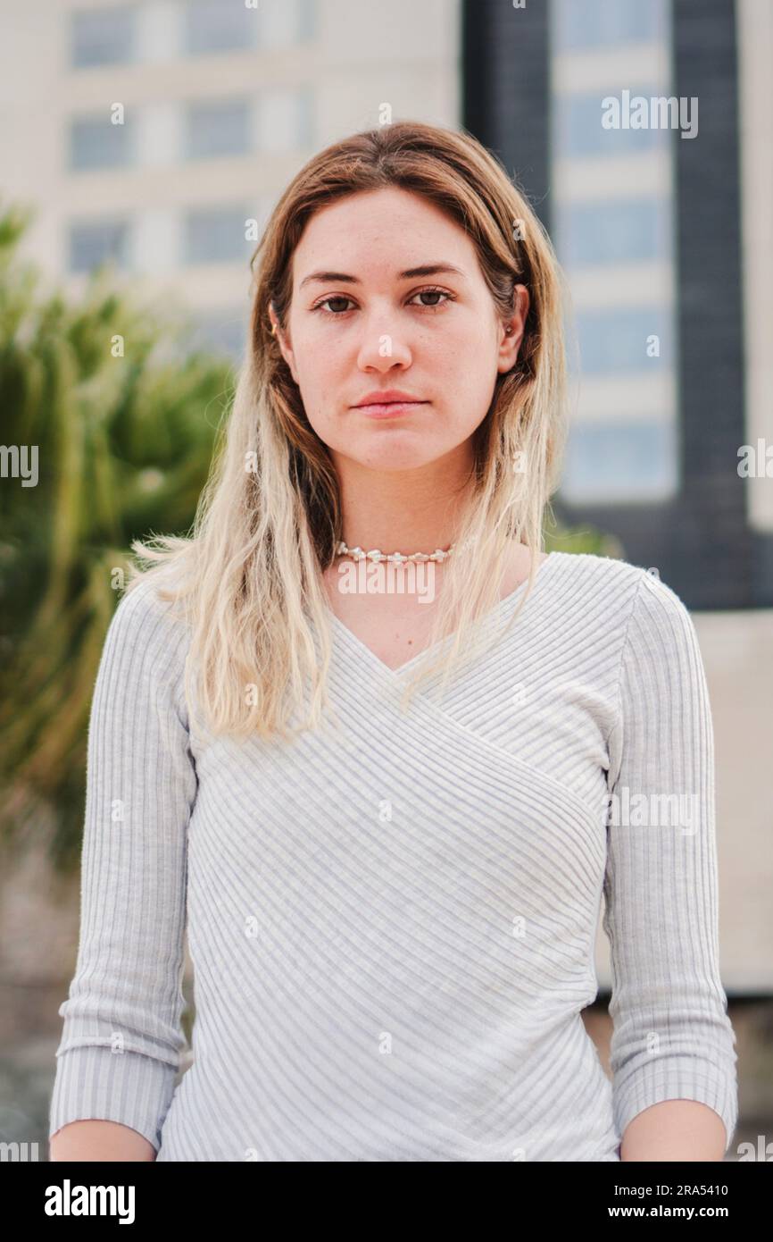 Vertical individual portrait of blonde caucasian young adult woman ...