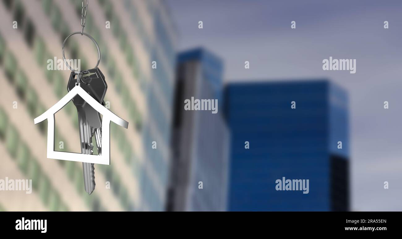 Image of hanging silver house keys against blurred view of tall ...