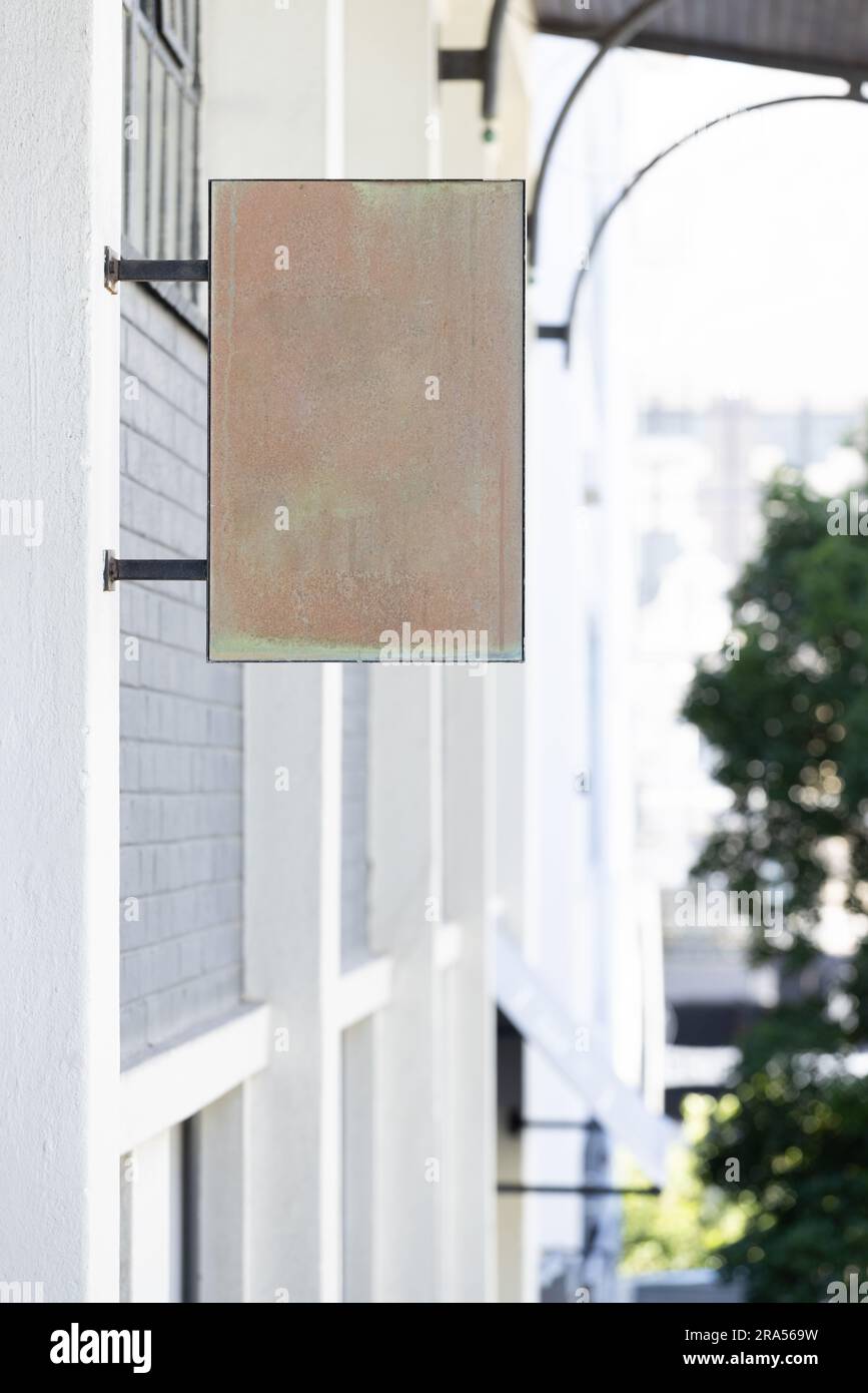 Blank sign fixed to building wall with copy space Stock Photo - Alamy