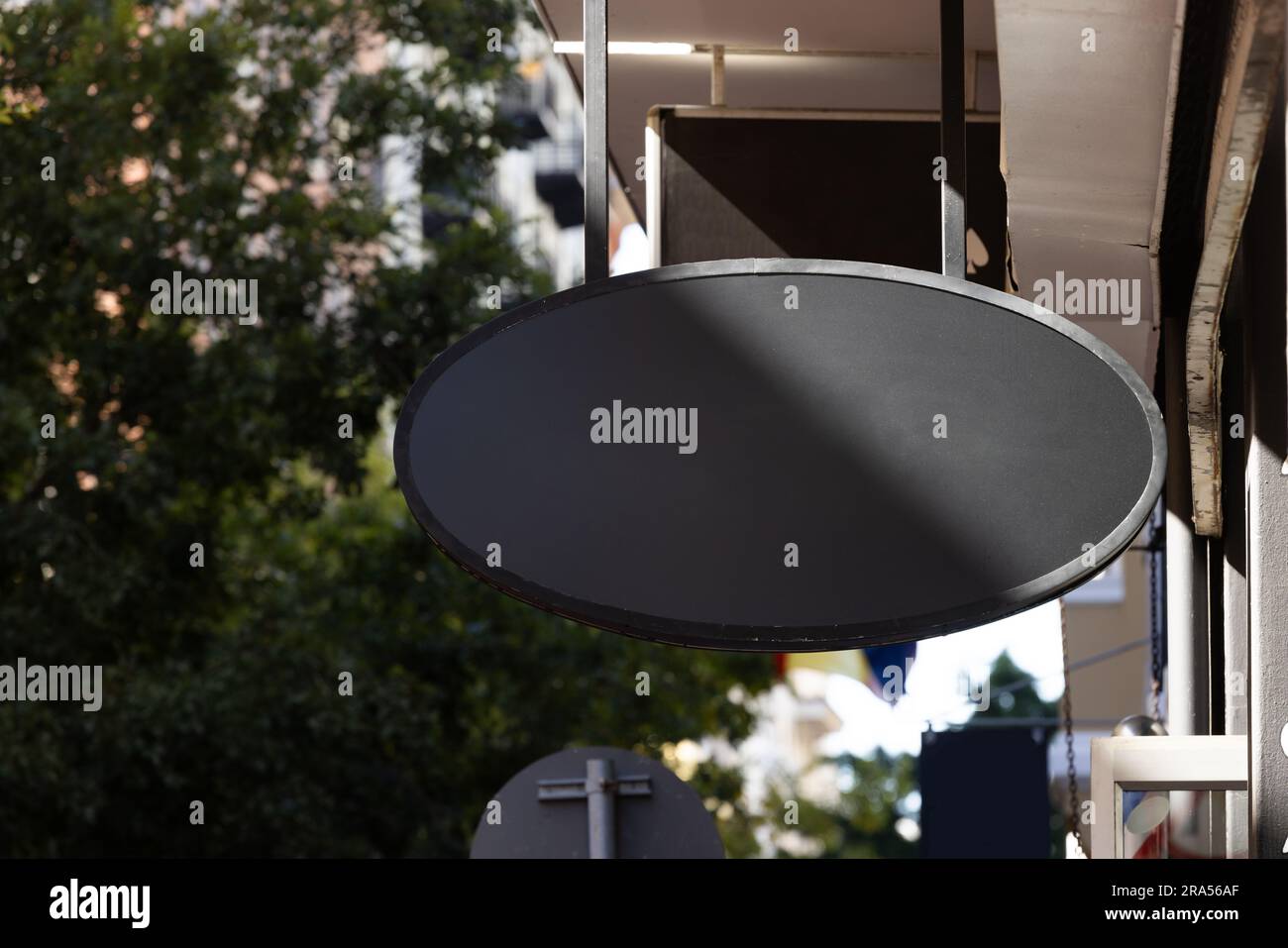 Blank sign hanging from building ceiling with copy space Stock Photo ...