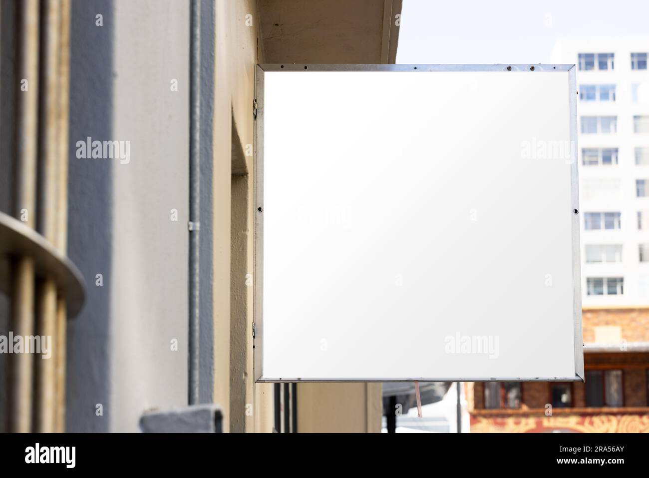 Blank sign fixed to building wall with copy space Stock Photo - Alamy