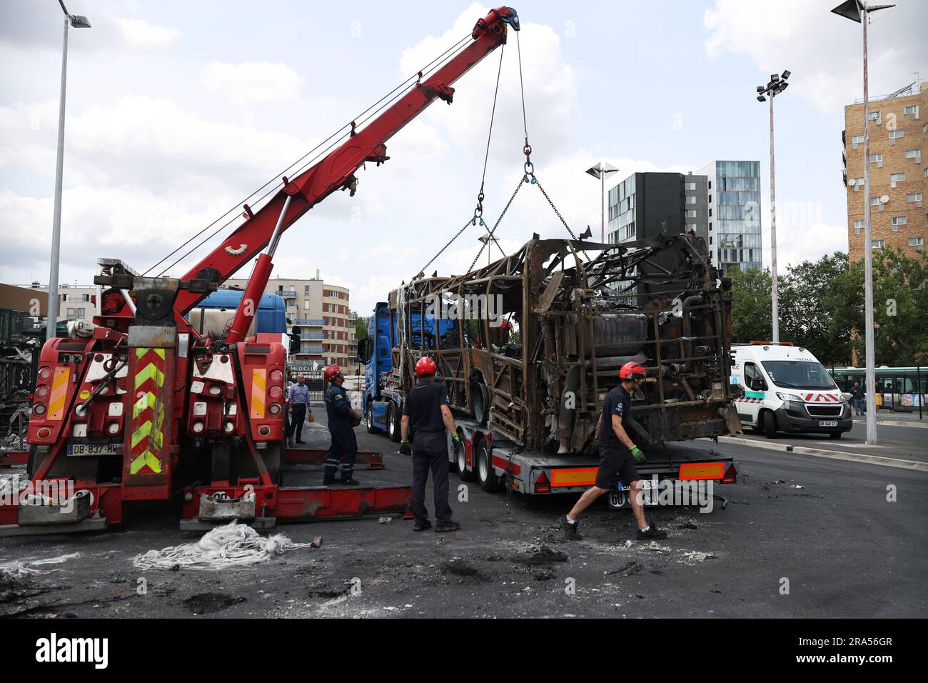 Aubervilliers, France. 1st July, 2023. Staff members try to drag away a ...
