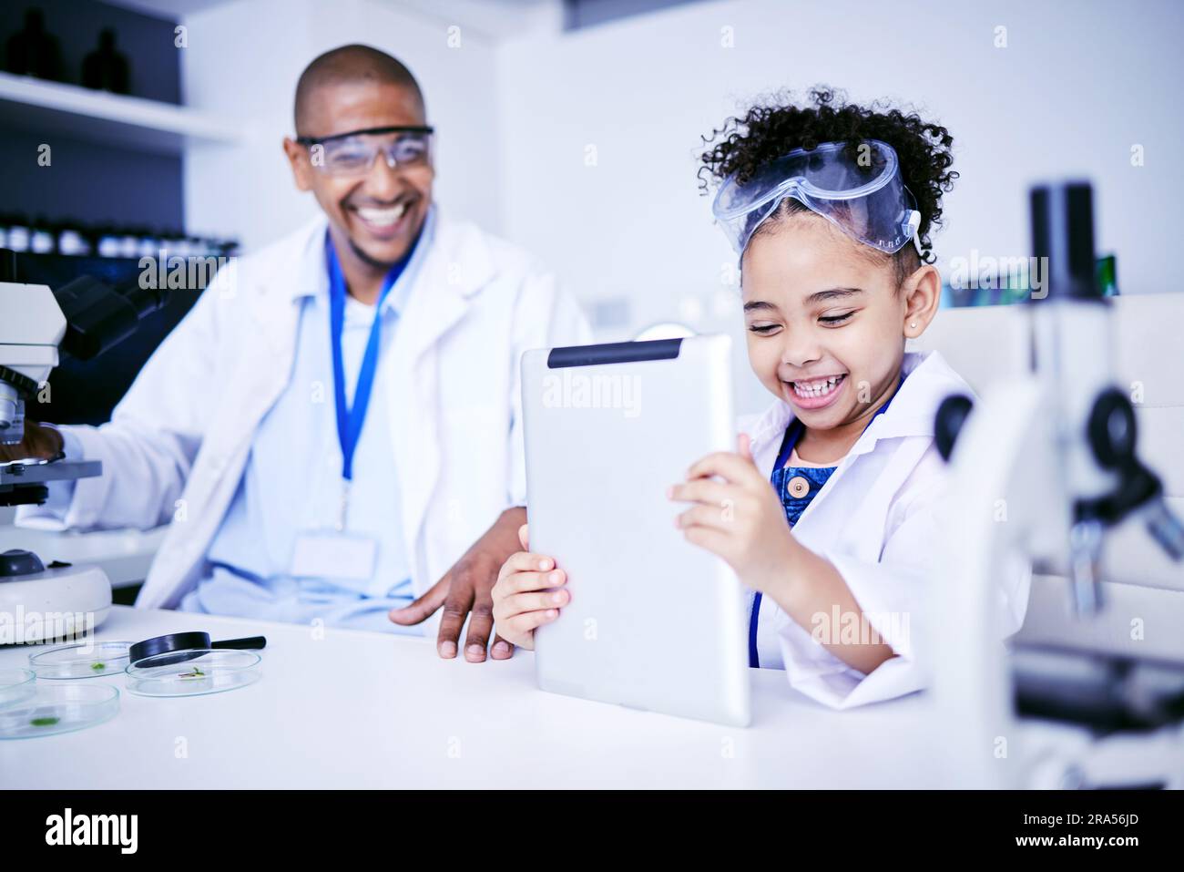 Chemistry, tablet and father with child in laboratory for medical ...