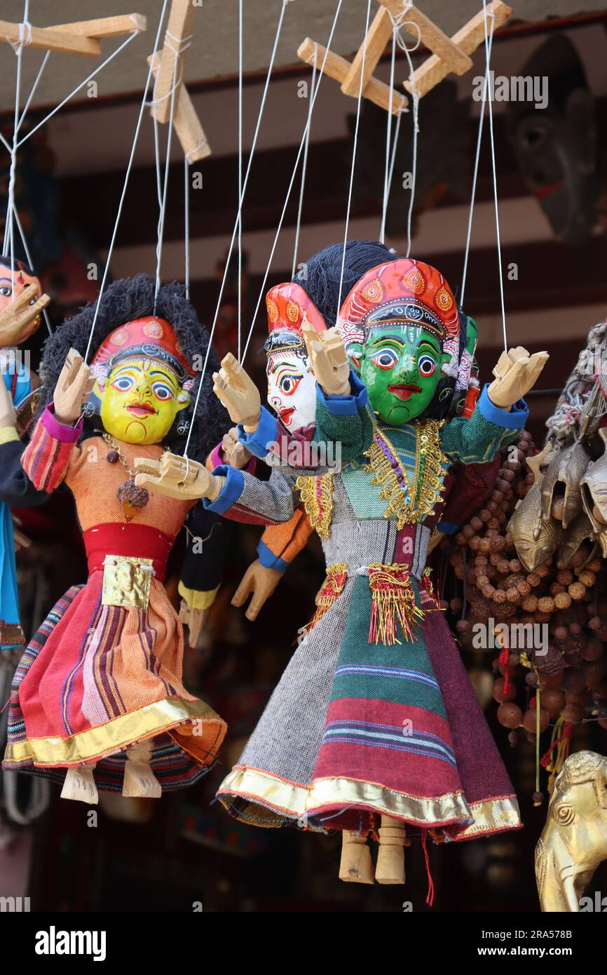Dancing Strings: Vibrant puppets gracefully suspended, crafted hanging ...