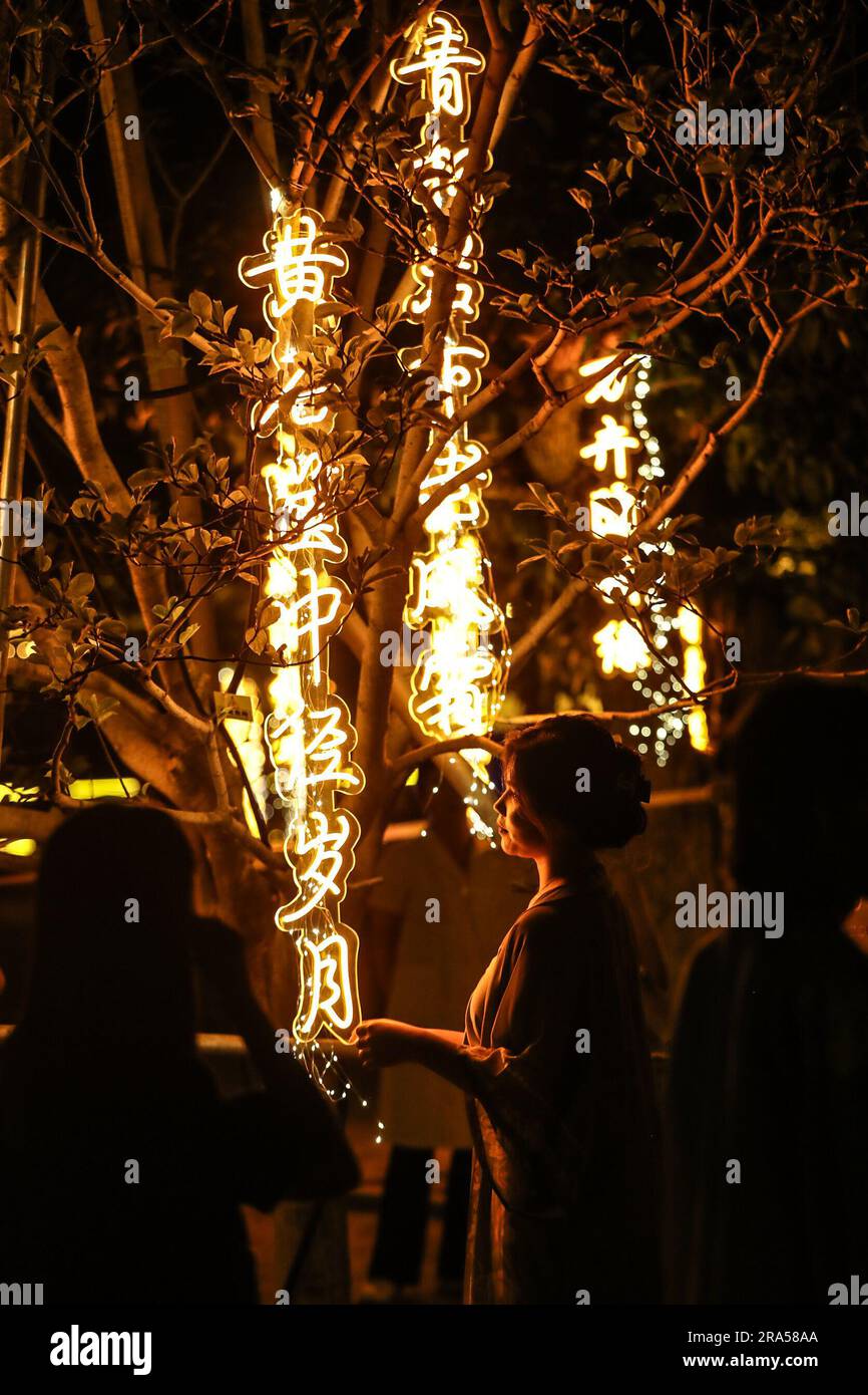 Huludao, China's Liaoning Province. 30th June, 2023. A tourist poses ...