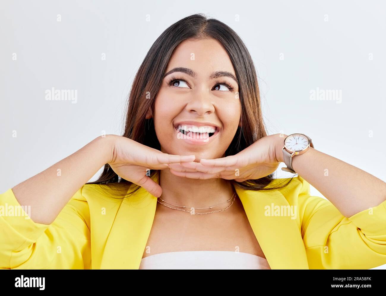 Hands, under chin and woman with happy face in studio isolated on a ...