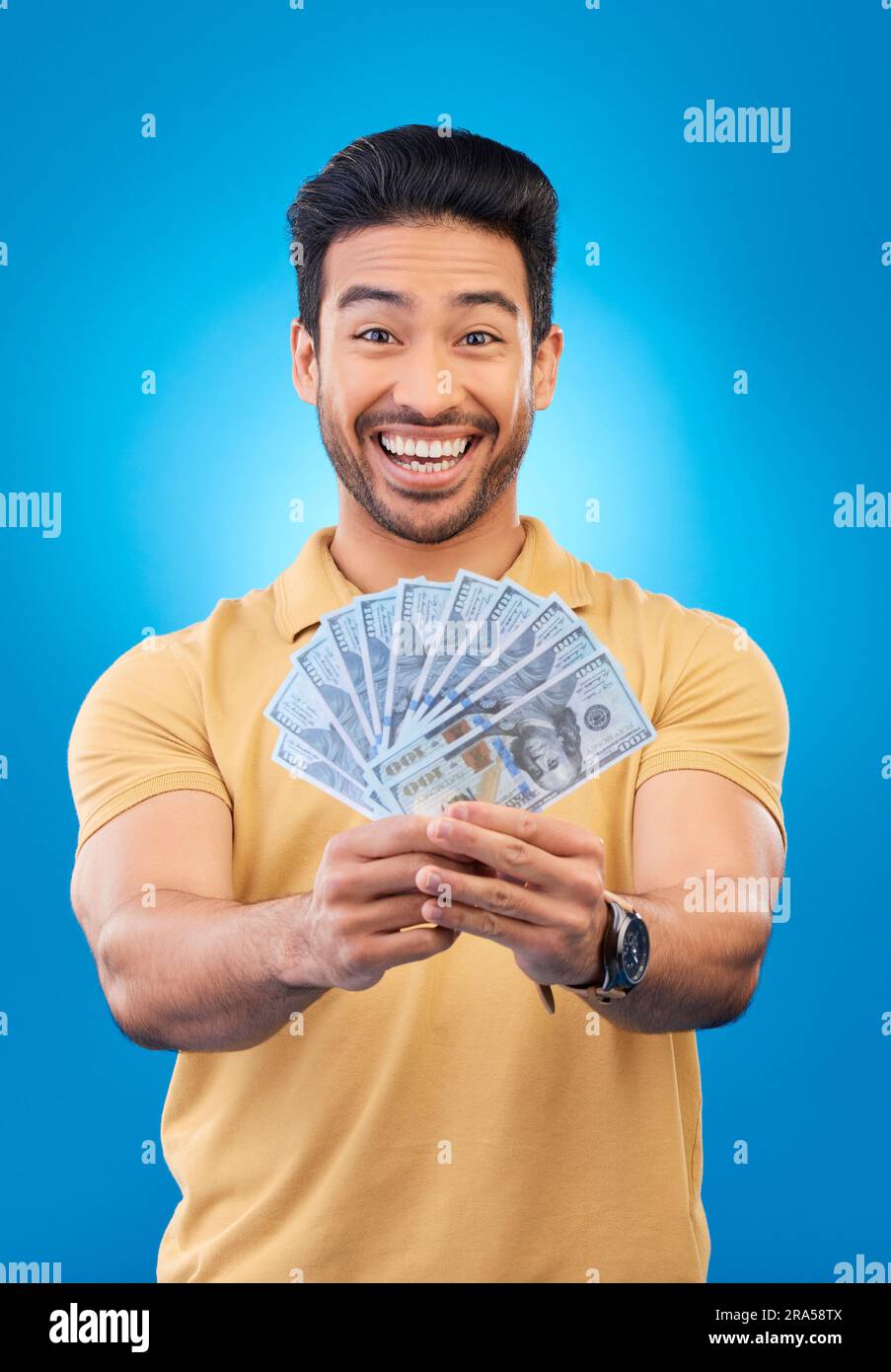 Happy, portrait of a man with money fan and in a blue background for ...