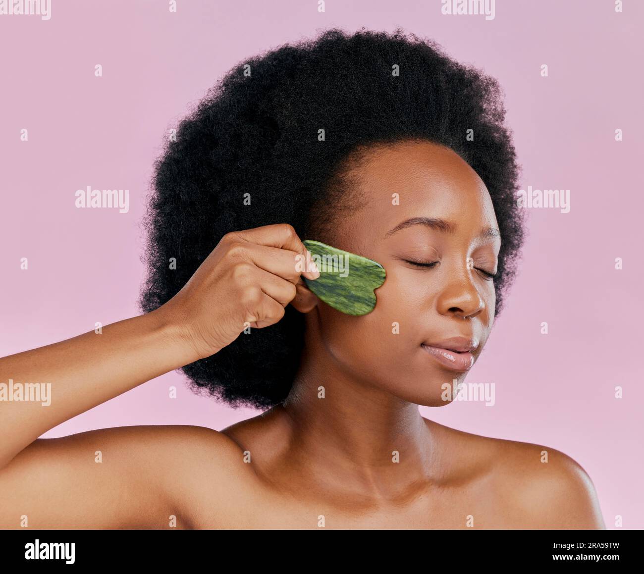 Gua sha, massage and black woman with natural beauty, face care and ...