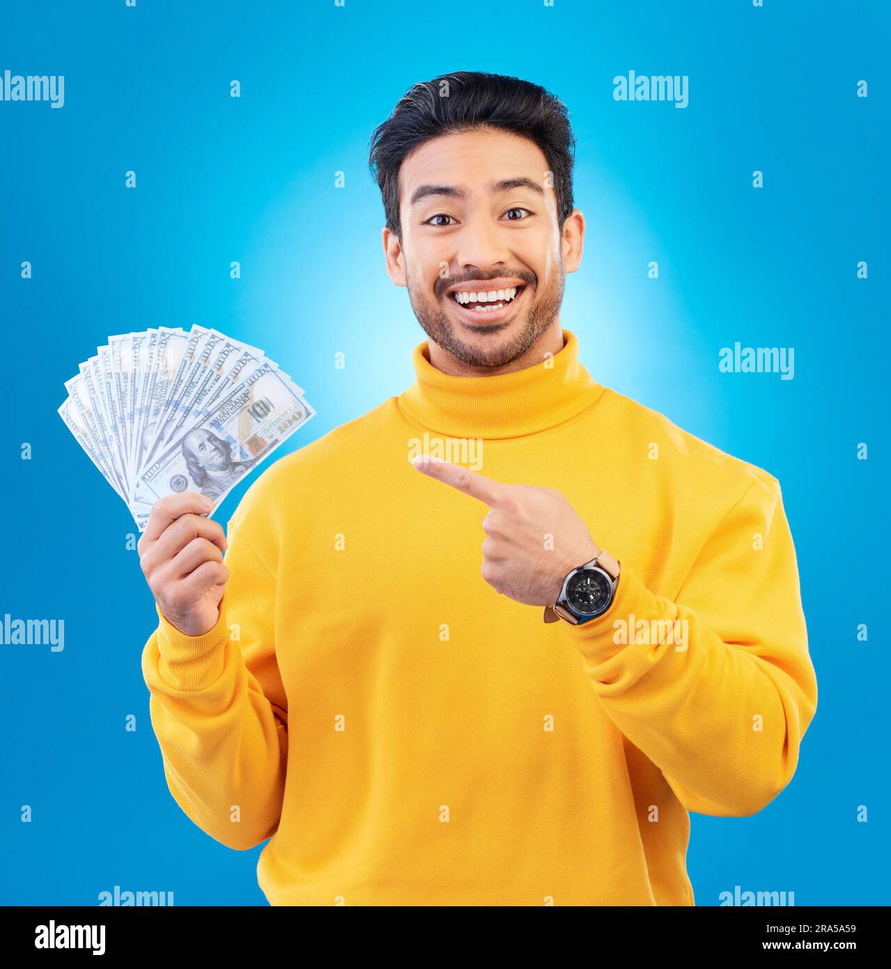 Money, studio portrait and happy man point at dollar bills, competition ...
