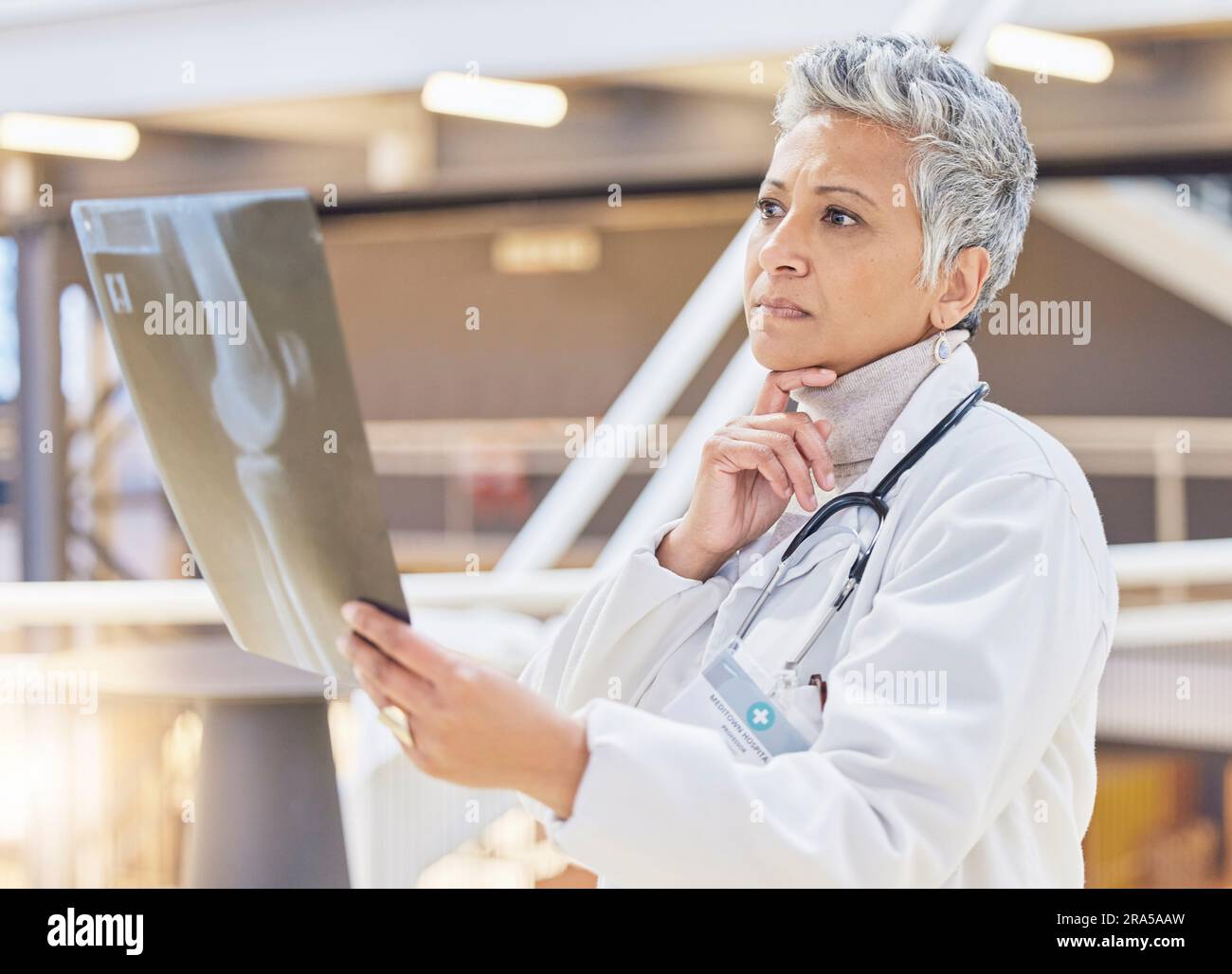 Senior doctor, analysis of xray and think with health, woman orthopedic ...