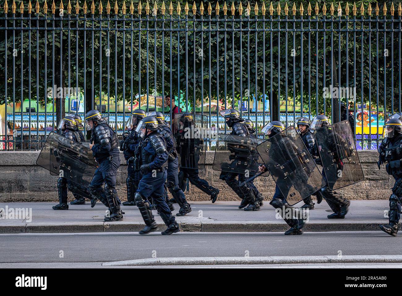 Paris, France. 30th June, 2023. A squad of police seen running during ...