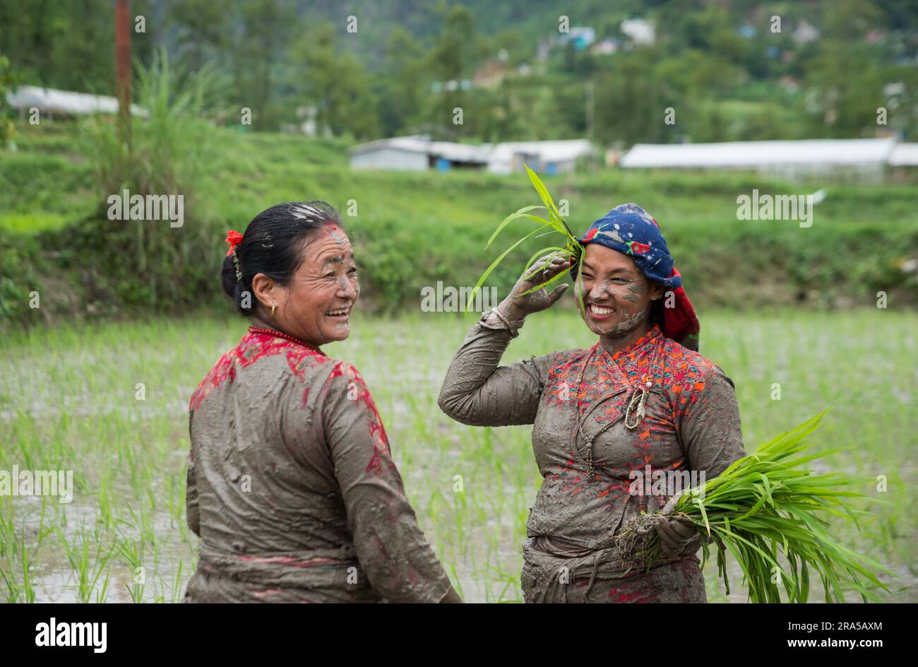 Kathmandu, Nepal. 30th June, 2023. A woman covered in mud smiles at a ...
