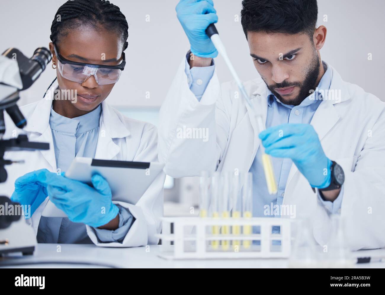 Man, black woman or scientists with test tubes in research for medical ...