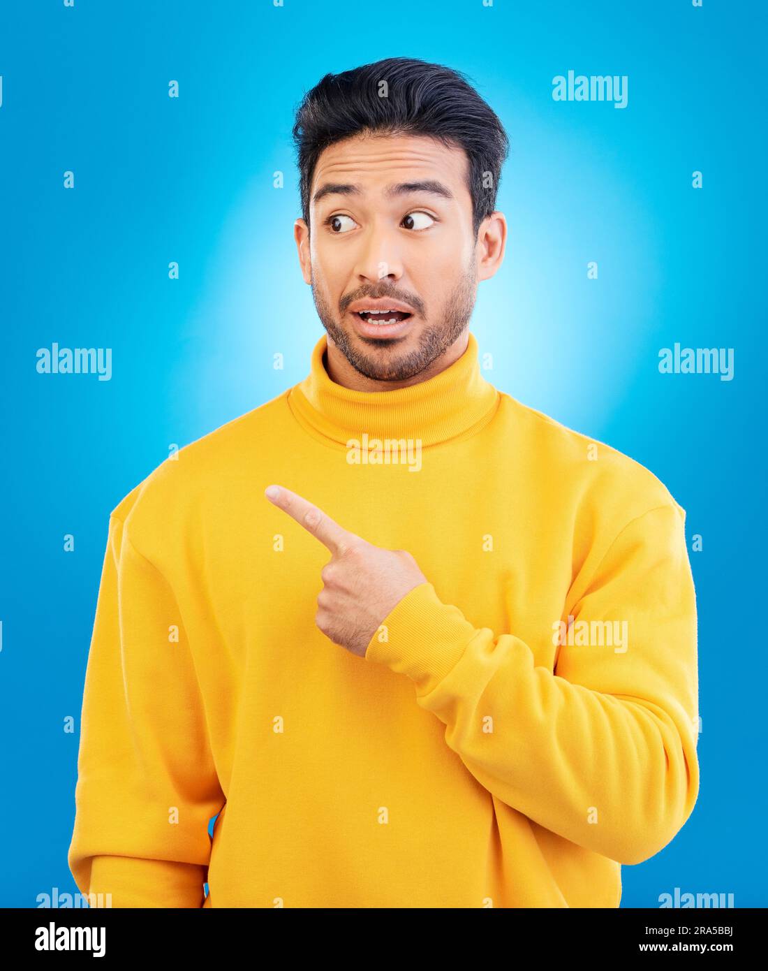 Man, point and thinking in studio with shock face for ideas, fashion ...