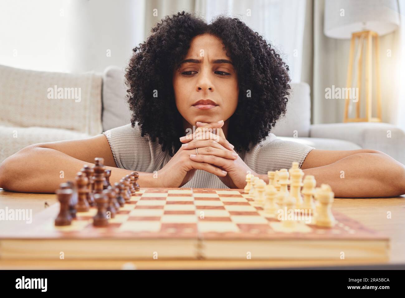 Thinking, strategy and face of woman with chess for problem solving ...