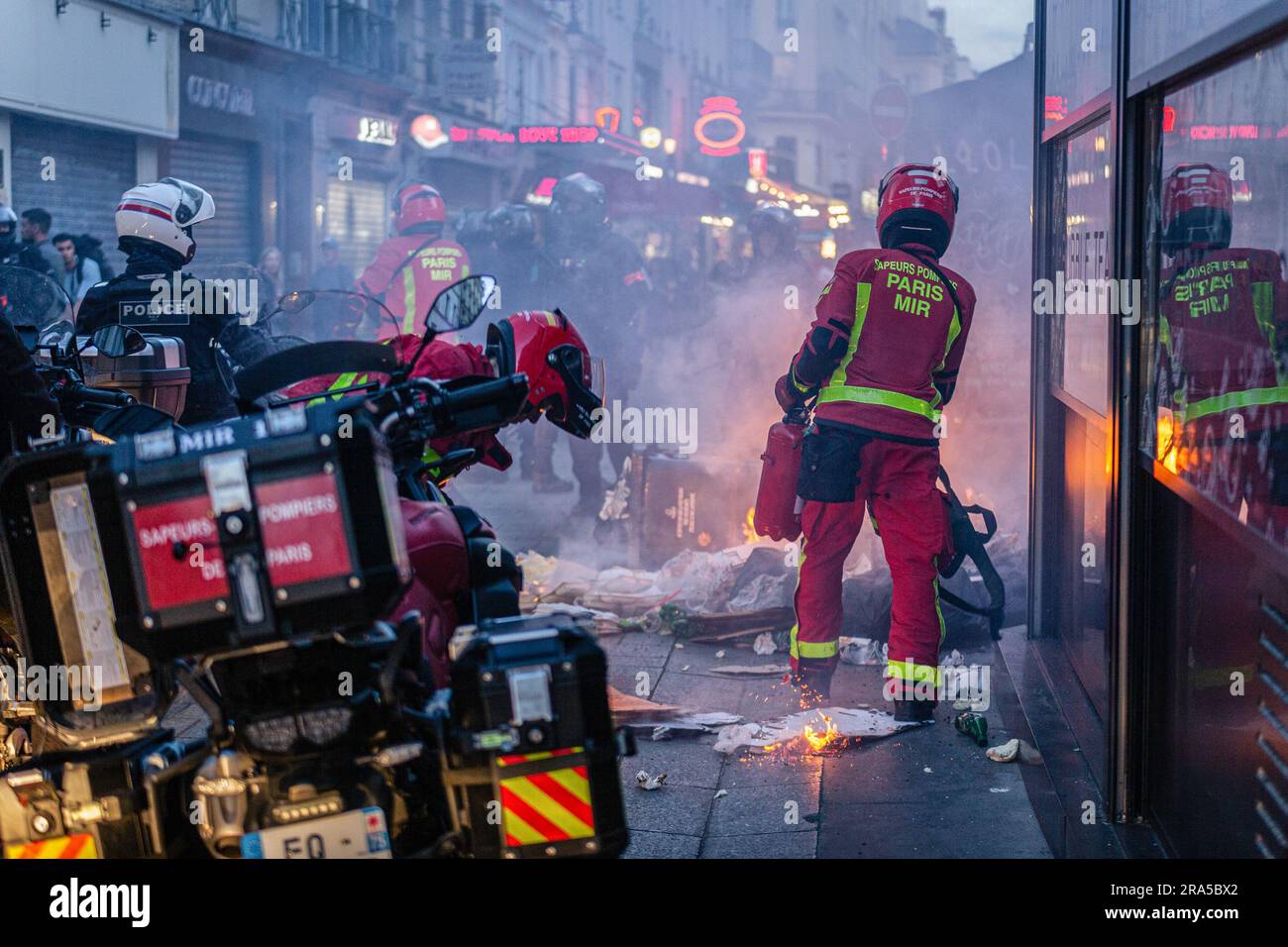 Paris, France. 30th June, 2023. Firefighters seen putting out a fire ...