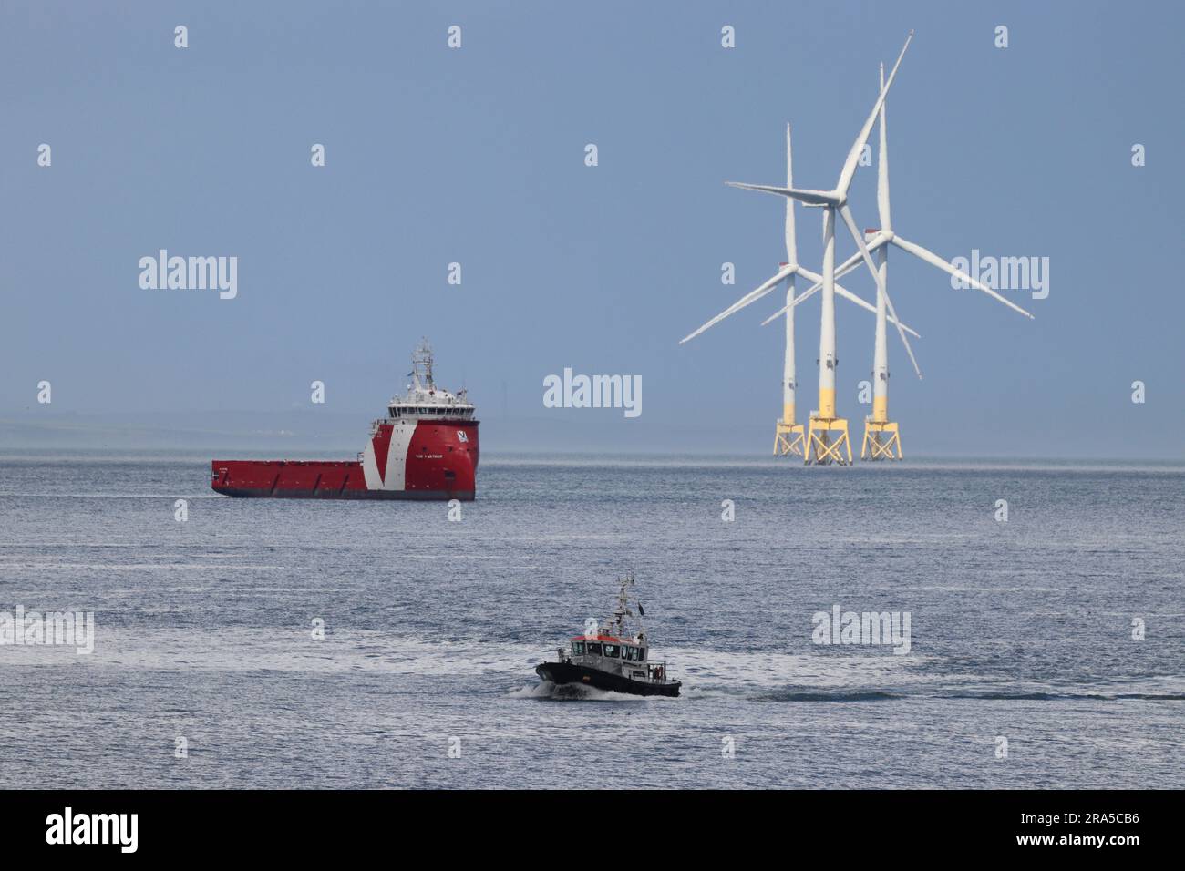 Boats and wind turbines Stock Photo - Alamy
