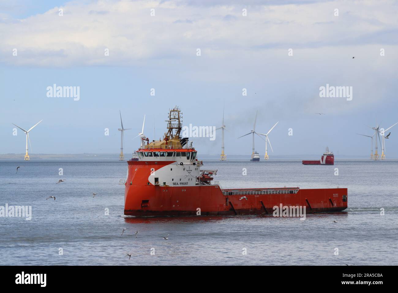 Boats and wind turbines Stock Photo - Alamy