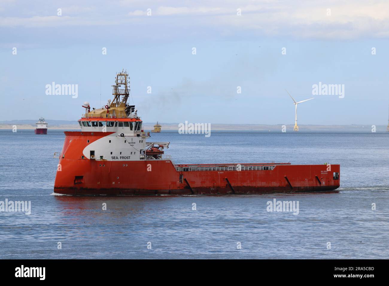 Boats and wind turbines Stock Photo - Alamy
