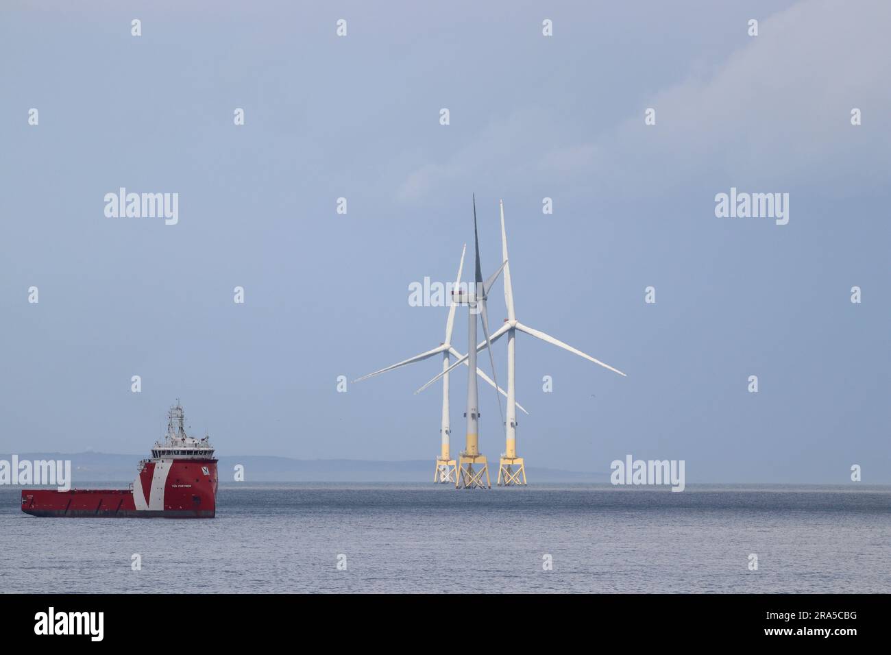 Boats and wind turbines Stock Photo - Alamy