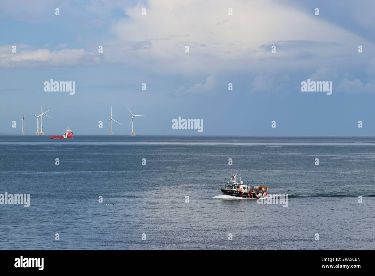 Boats and wind turbines Stock Photo - Alamy