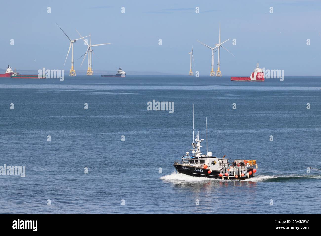 Boats and wind turbines Stock Photo - Alamy