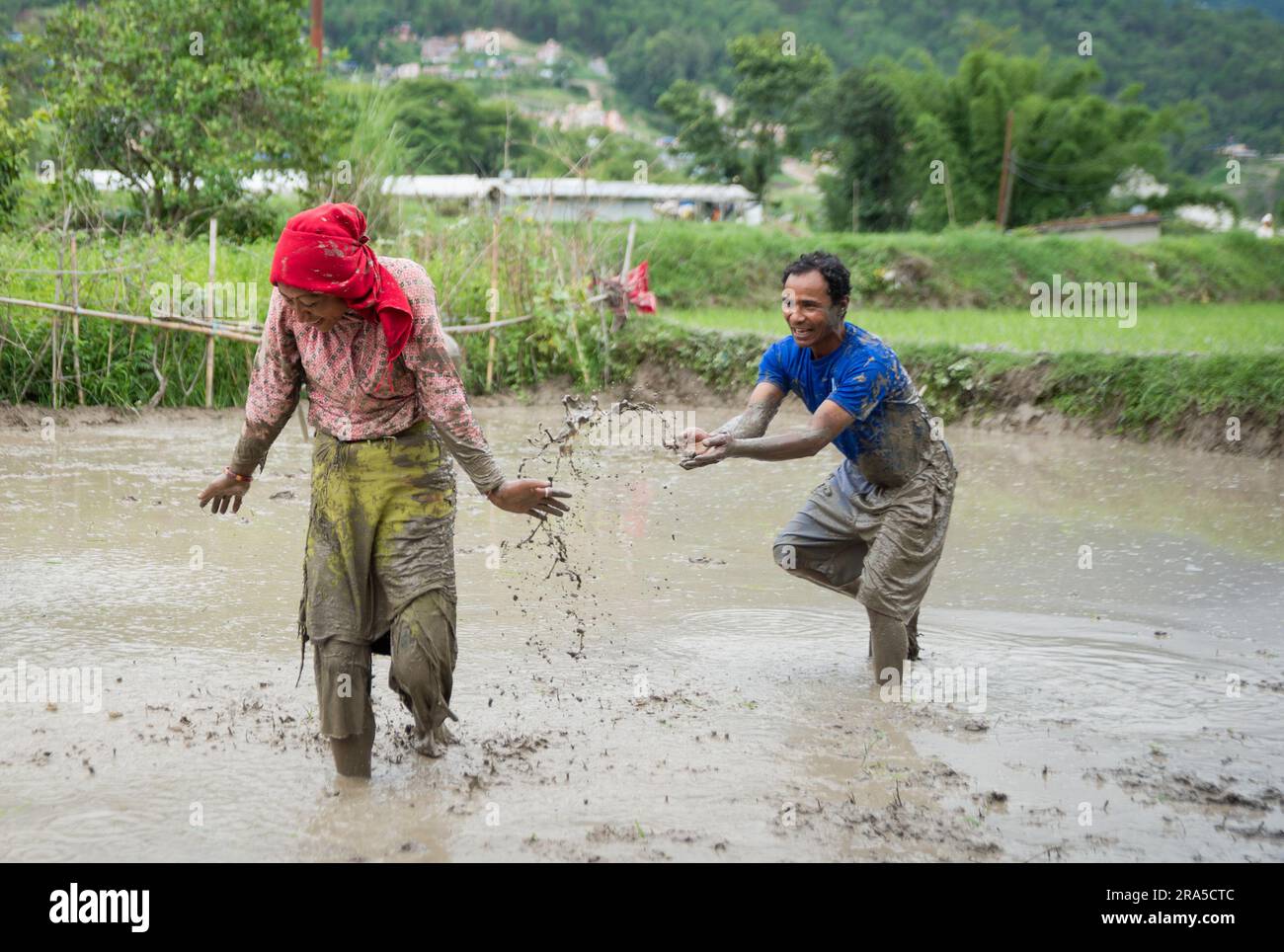 Kathmandu, Nepal. 30th June, 2023. People play in muddy water at a ...