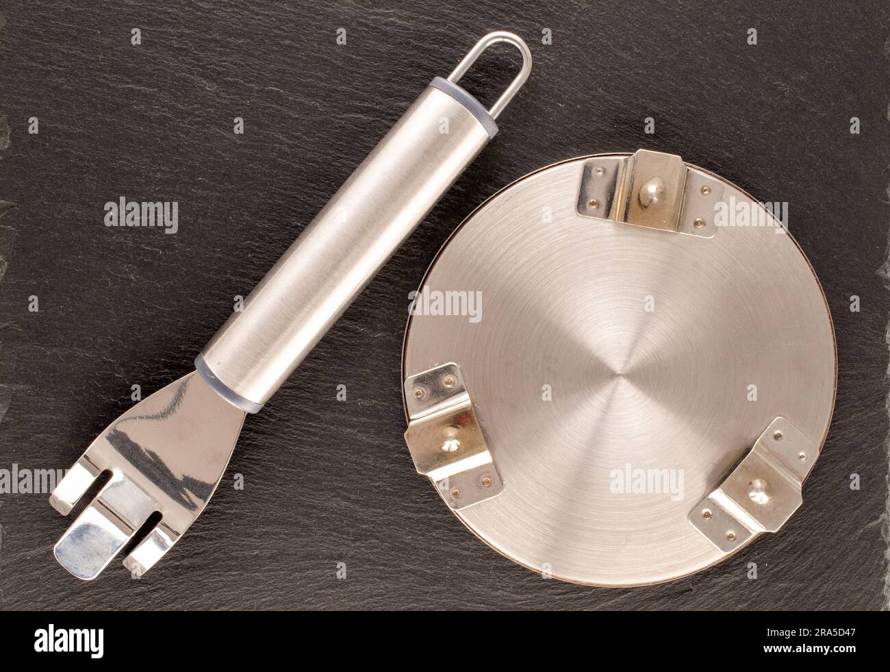 One metal adapter with handle for induction surface on slate stone ...
