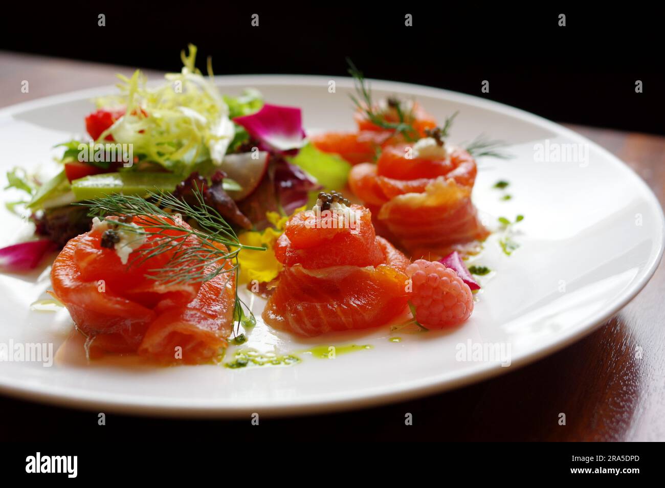Salmon rose sushi roll with mayo and caviar Stock Photo - Alamy