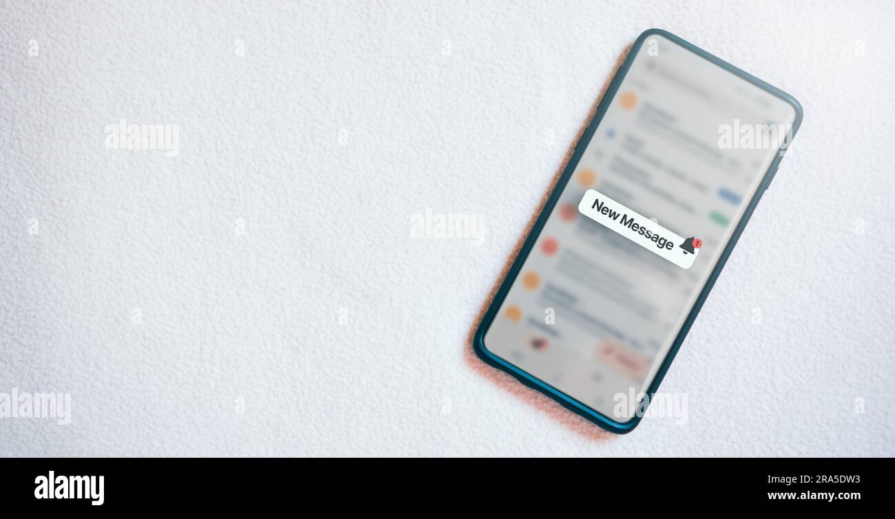Banner of a smartphone with a new message notification on screen and ...