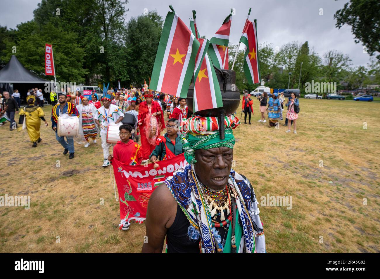 The flags of Surinam, a former Dutch colony, sit in a kettle atop the ...