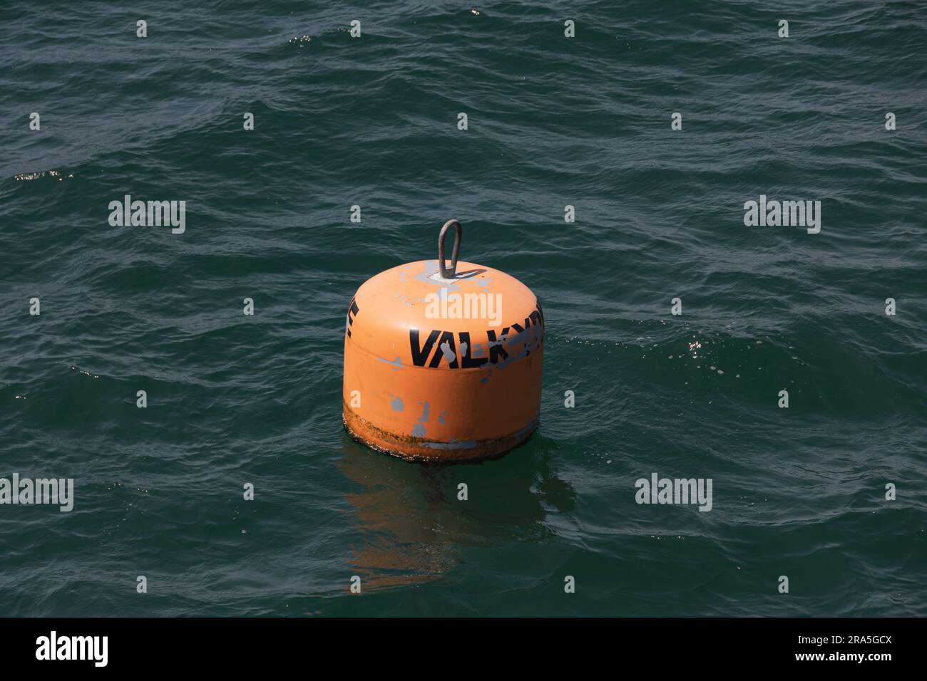 An oramge nouy floating in the sea at Brighton, UK Stock Photo - Alamy