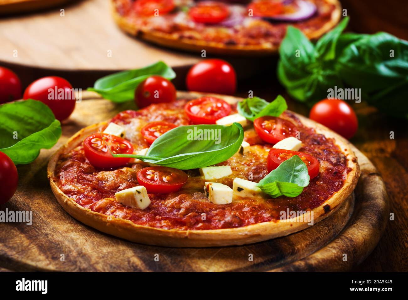 Homemade pizza with basil, tomatos and onion Stock Photo - Alamy